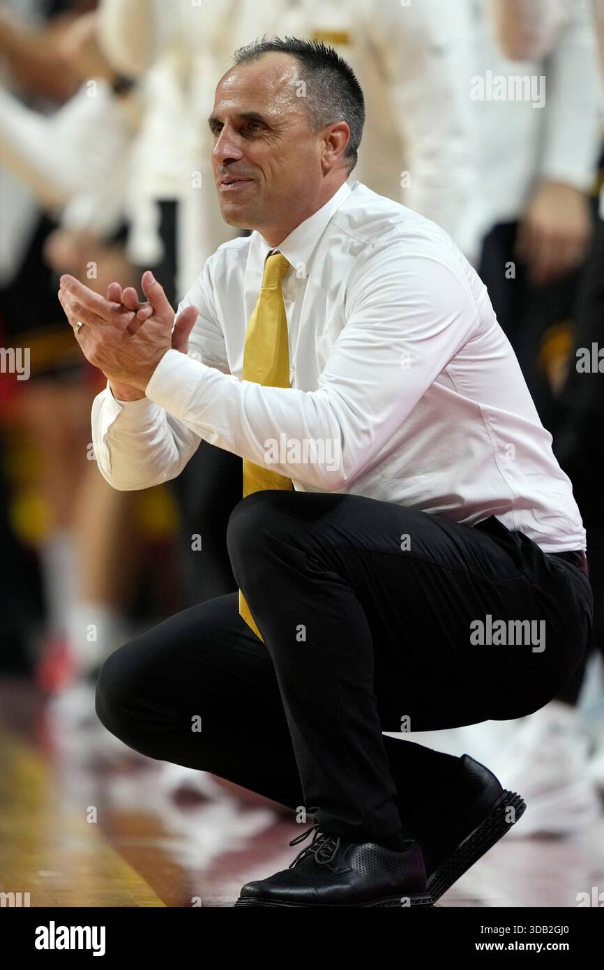 Iowa head coach Ben McCollum watches from the bench during the second ...