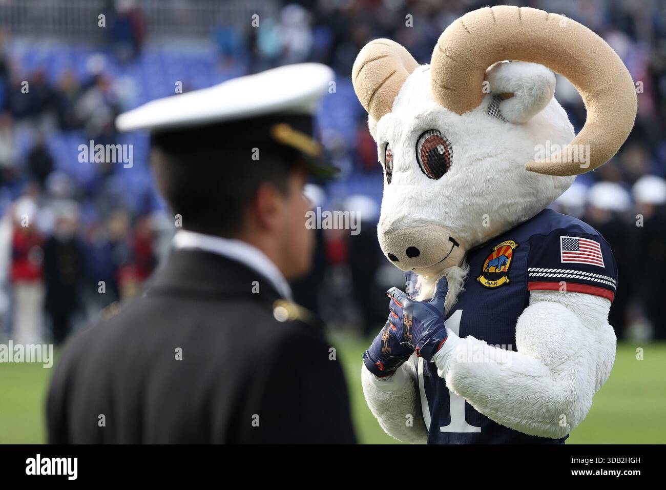 Navy Midshipmen march with the Navy mascot before an NCAA college ...