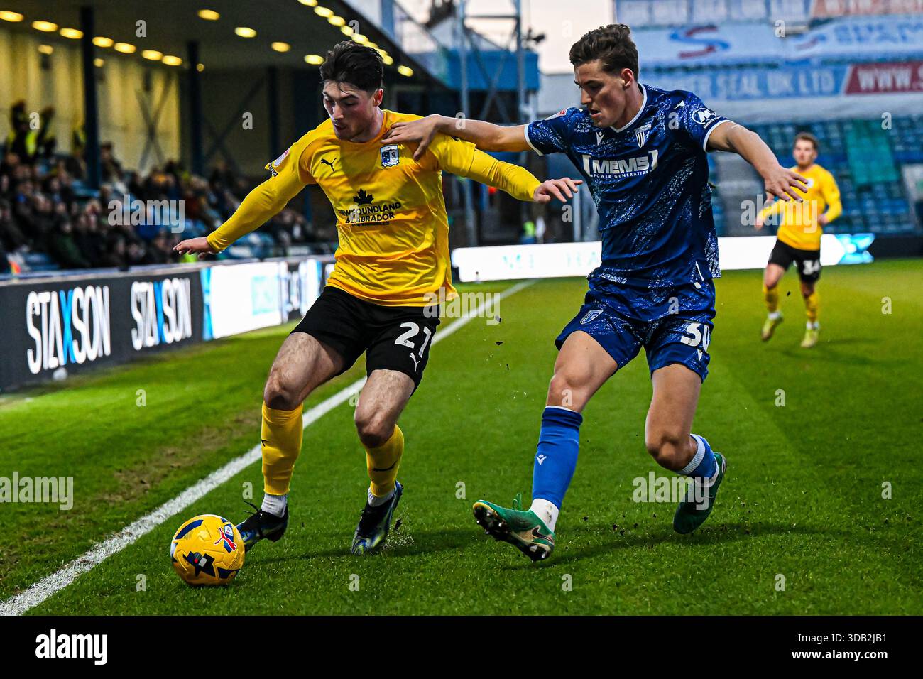 David Worrall of Barrow AFC challenegd by Sam Gale of Gillingham during ...