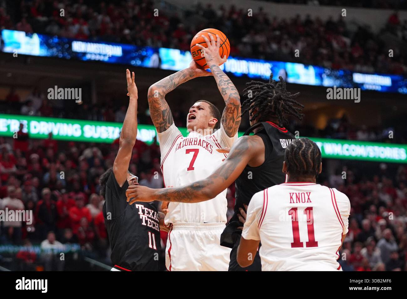 Arkansas forward Trevon Brazile (7) shoots over Texas Tech guard Jaylen ...