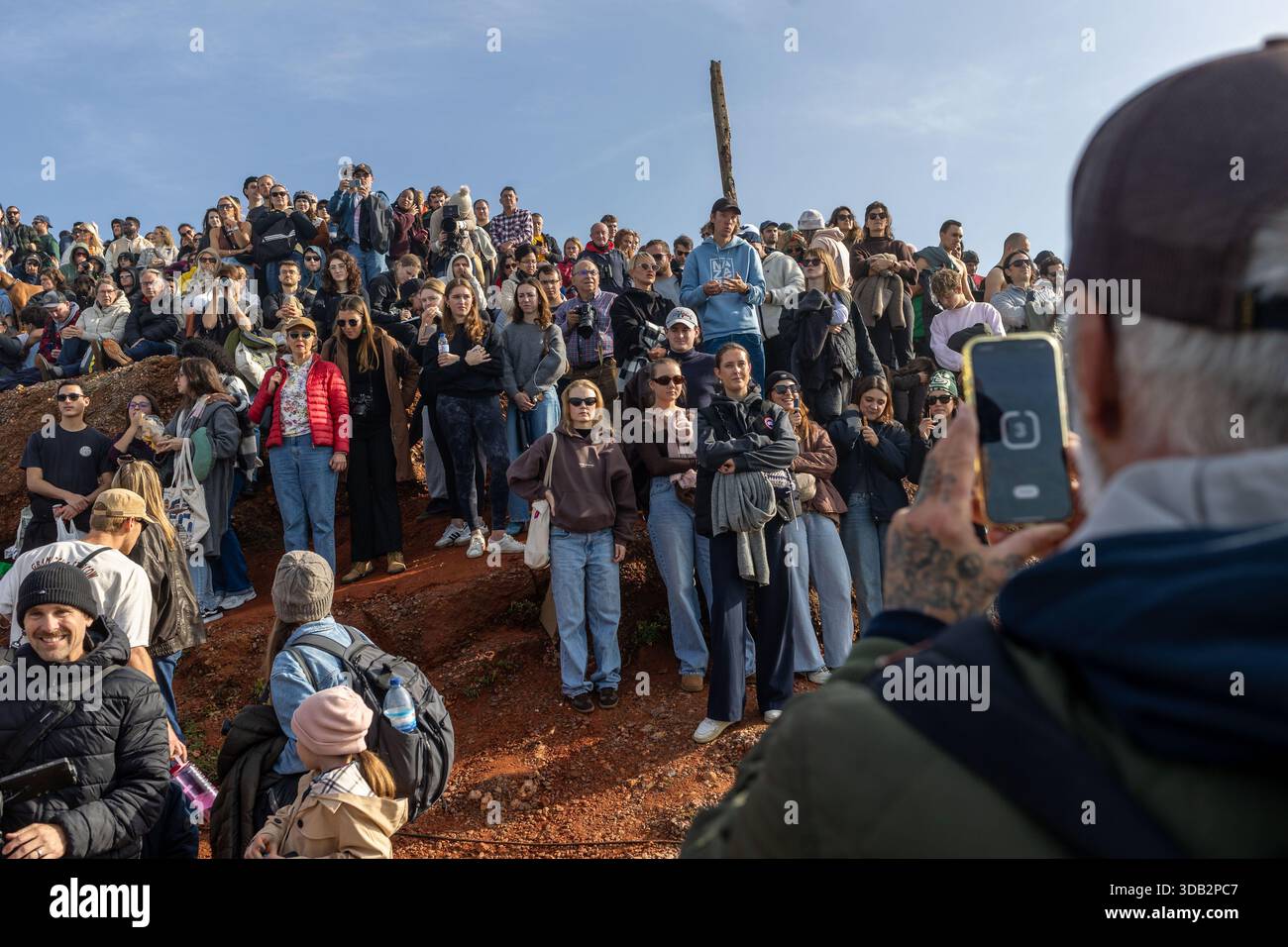 December 13, 2025, Nazare, Portugal: Spectators gather on the red ...