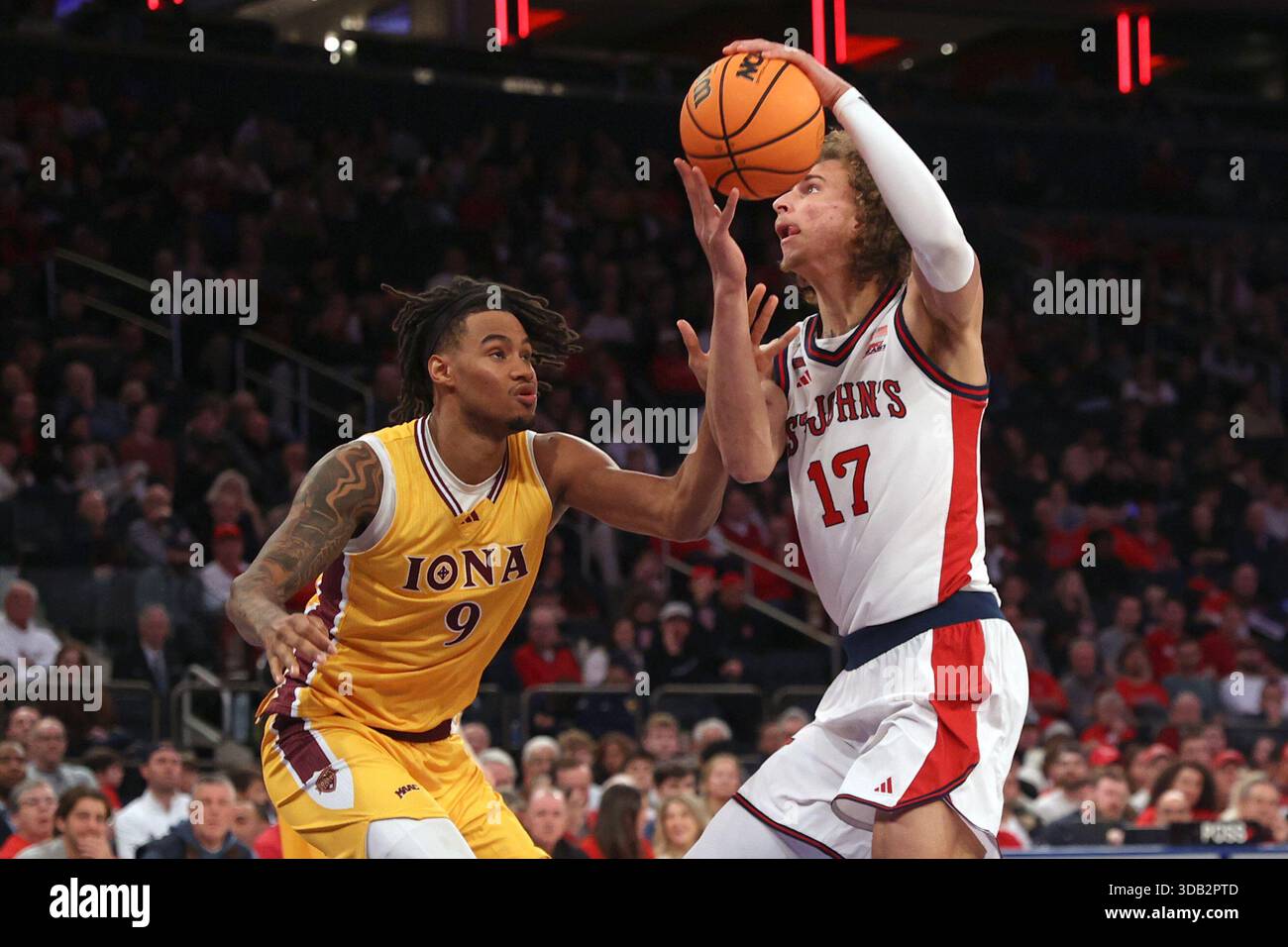 St. John's forward Ruben Prey (17) drives to the basket against Iona ...