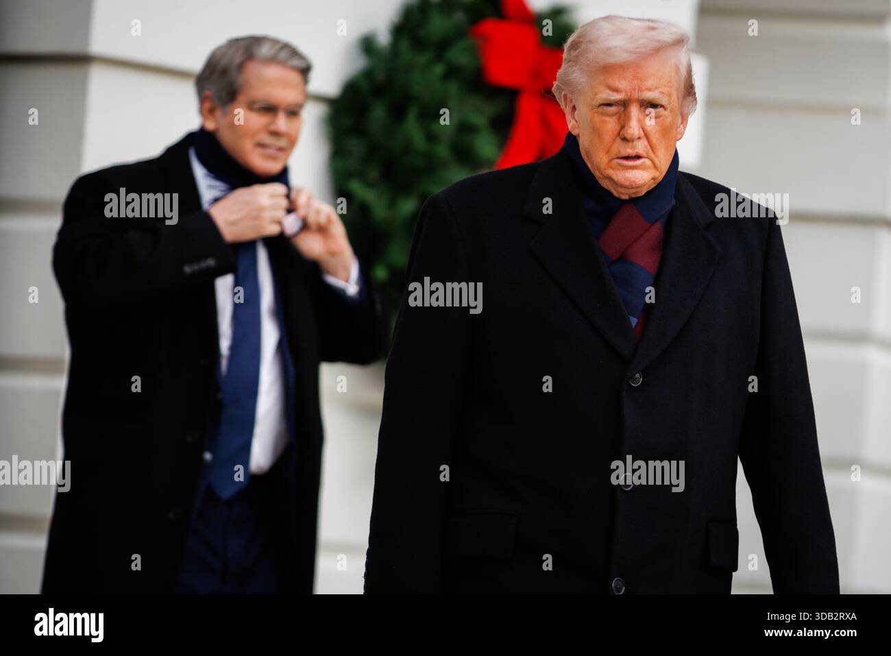 U.S. President Donald Trump and Treasury Secretary Scott Bessent walk ...