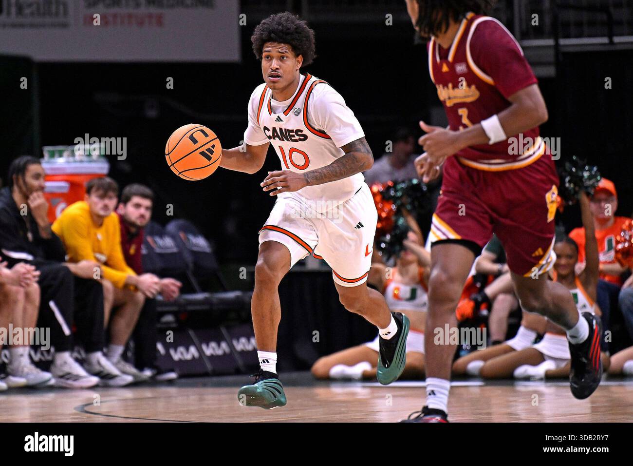 CORAL GABLES, FL - DECEMBER 13: Miami guard Tru Washington (10) brings ...