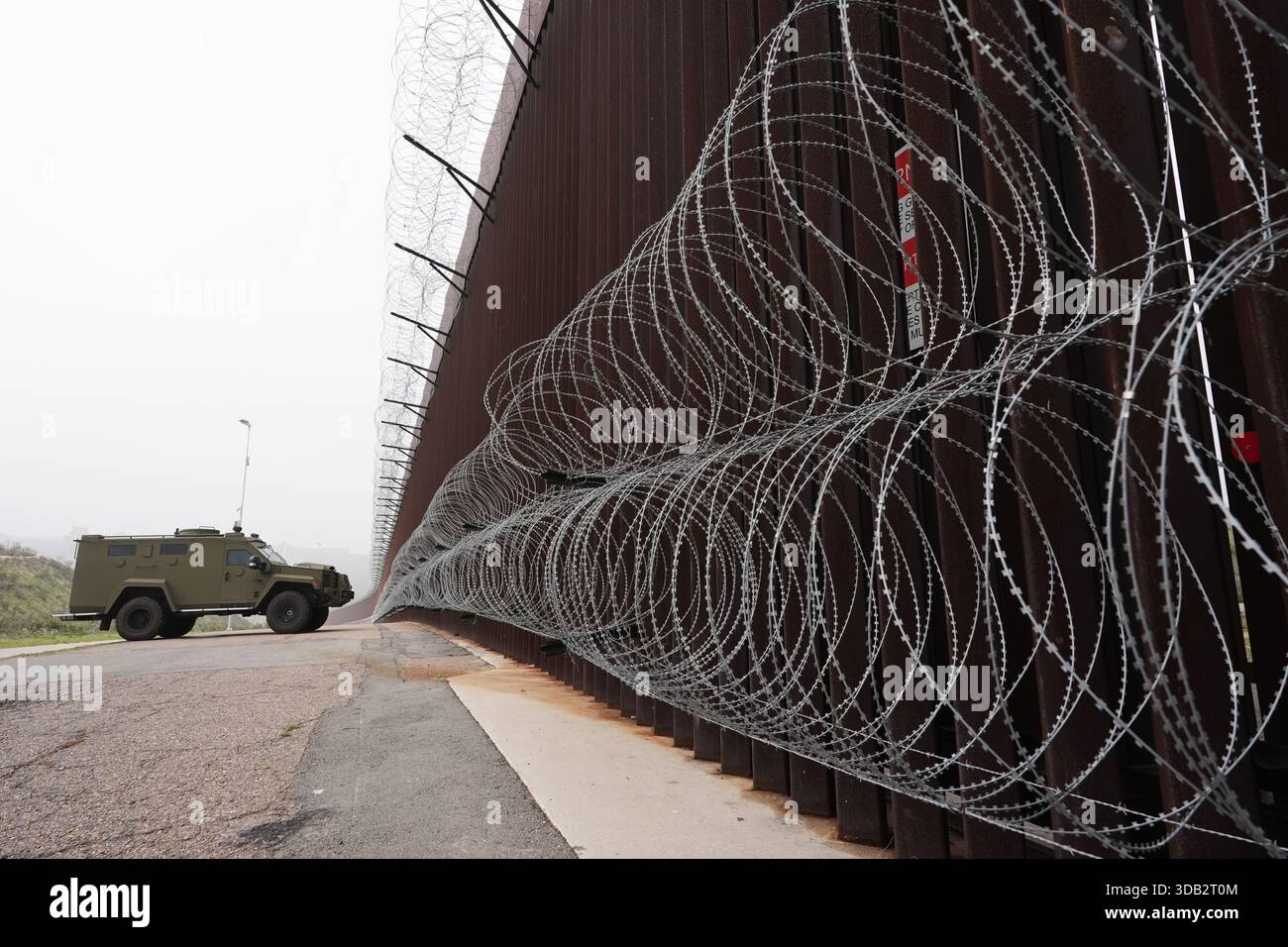 An armored vehicle sits near a news conference with White House border ...