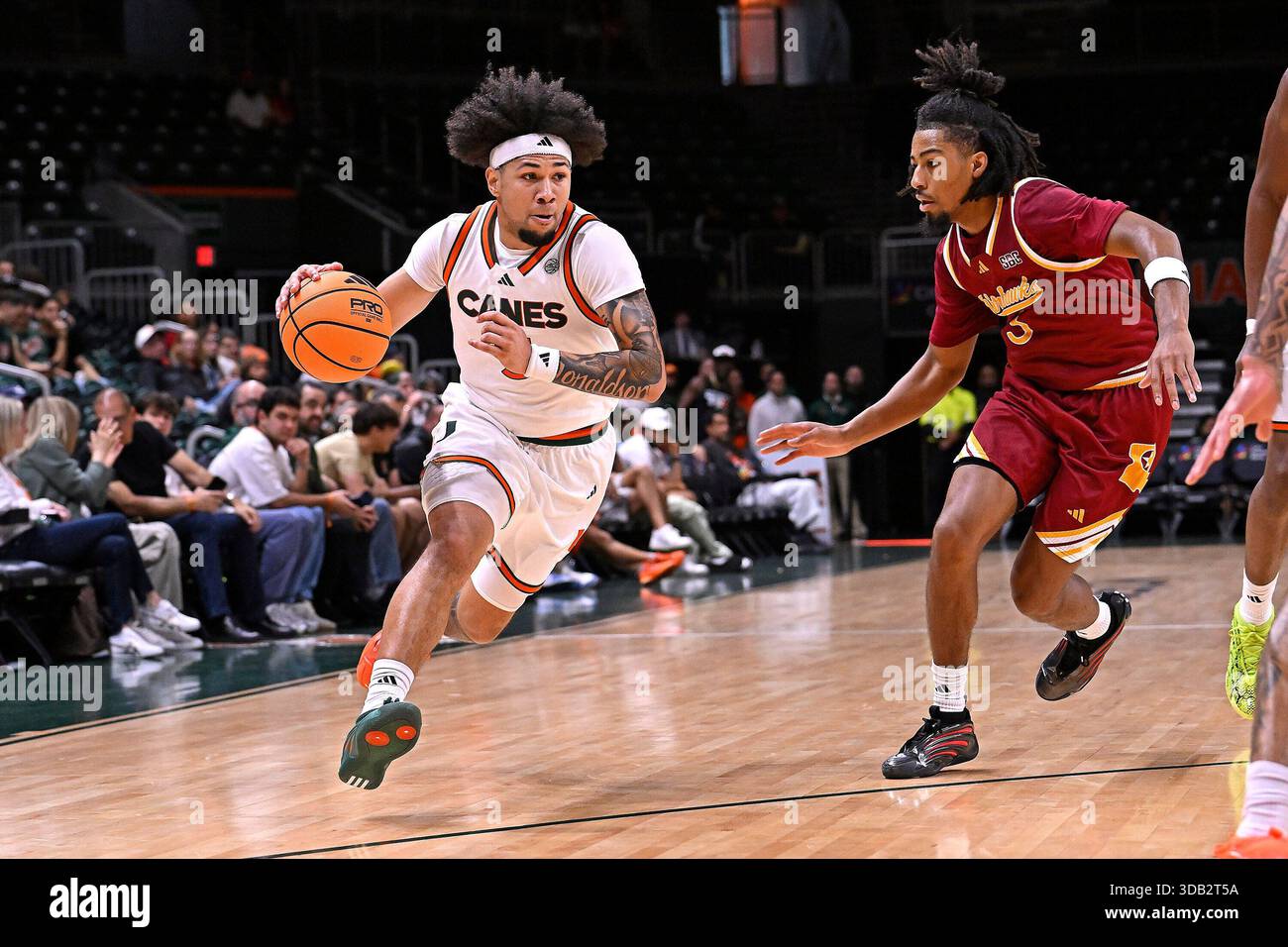 CORAL GABLES, FL - DECEMBER 13: Miami guard Tre Donaldson (3) drives to ...