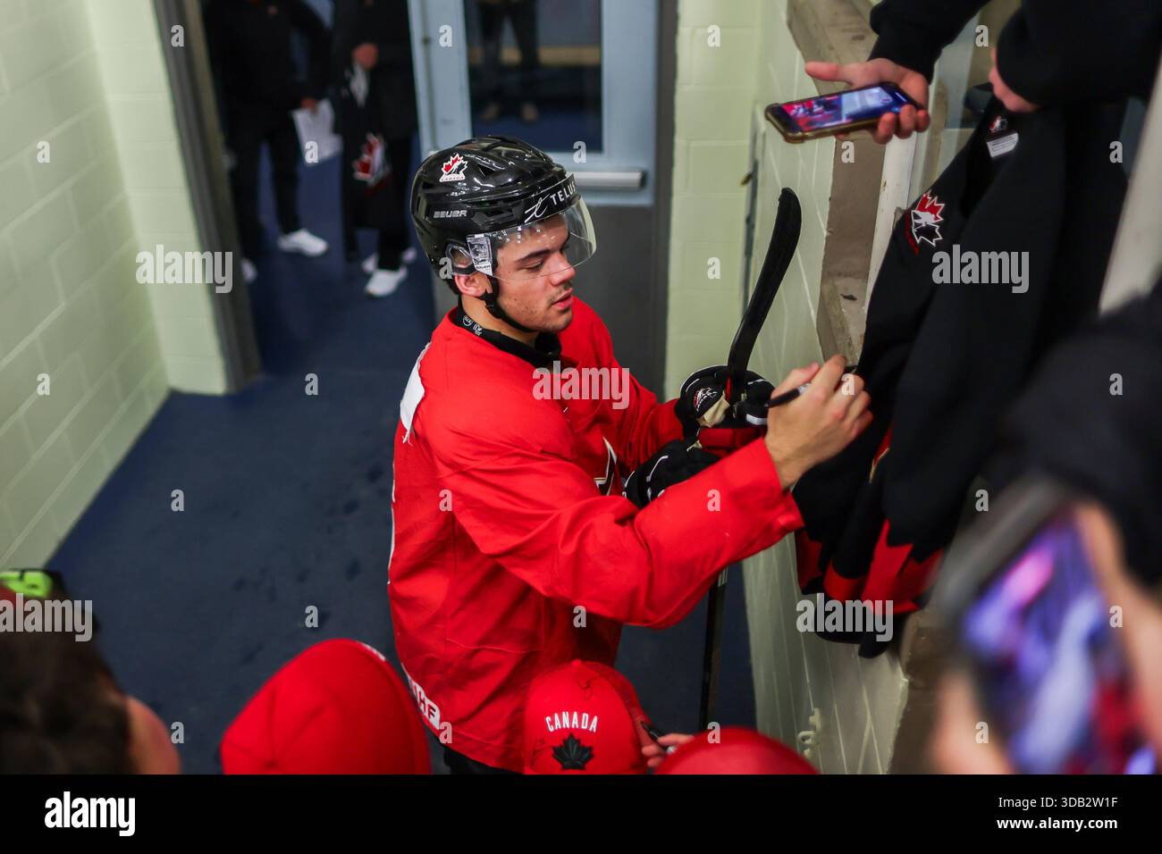 Tij Iginla, of Lake Country, B.C., signs autographs for fans during ...