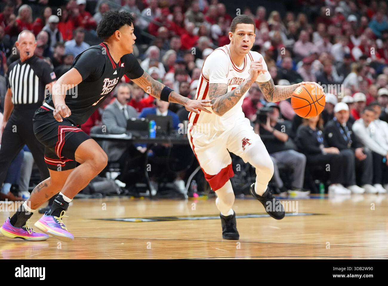 Arkansas forward Trevon Brazile (7) drives against Texas Tech forward ...