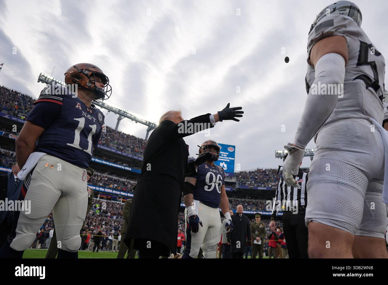 President Donald Trump takes part in the ceremonial coin toss before ...