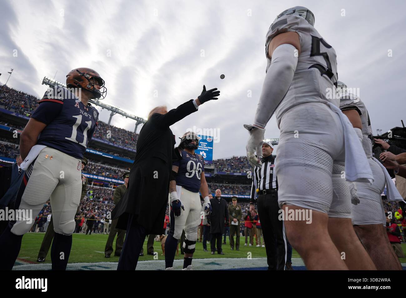 President Donald Trump takes part in the ceremonial coin toss before ...