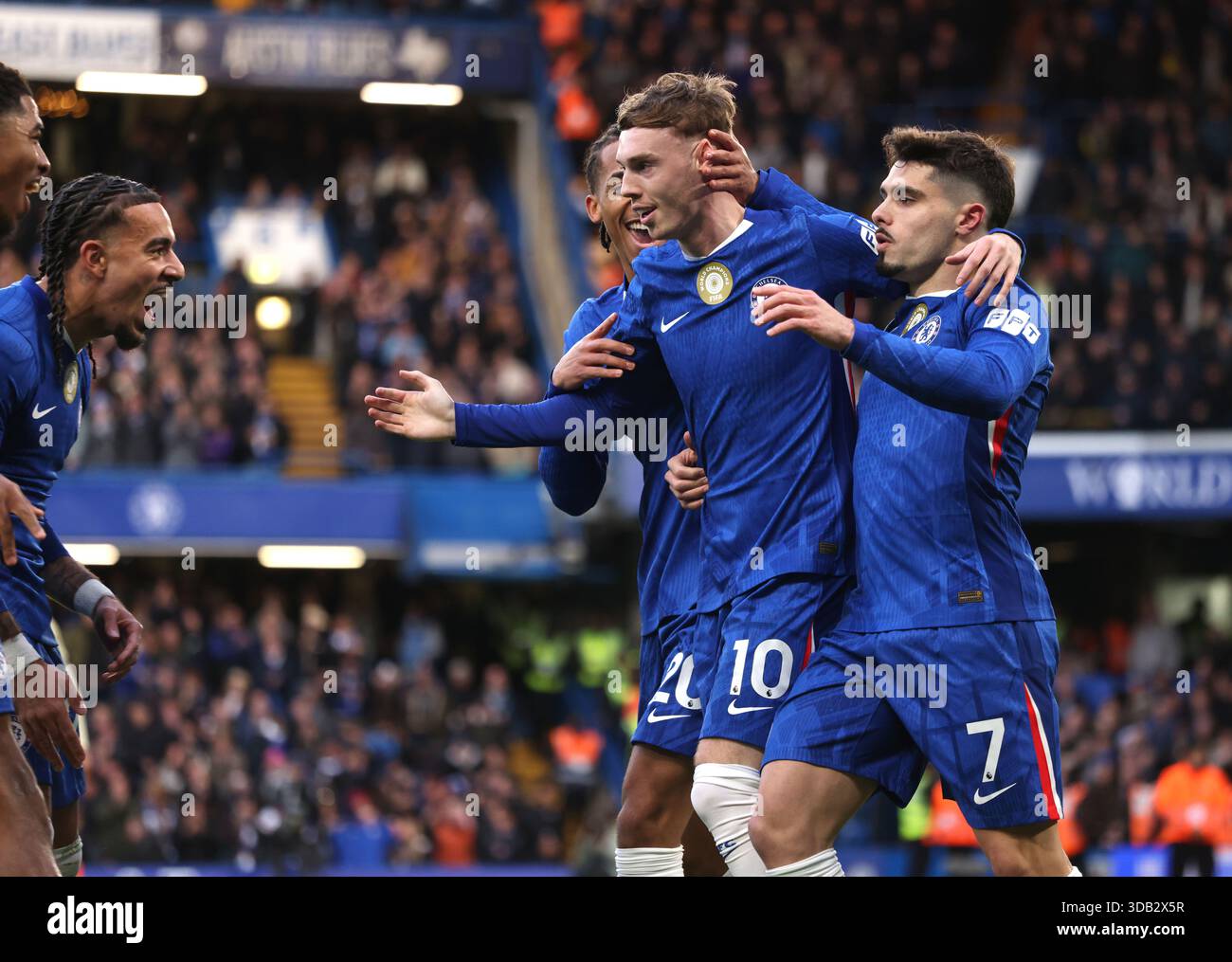 Chelsea players congratulate Cole Palmer (C) after he scored the first ...