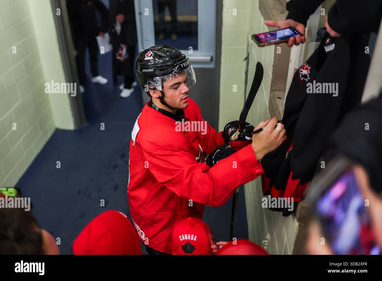 Tij Iginla, of Lake Country, B.C., signs autographs for fans during ...