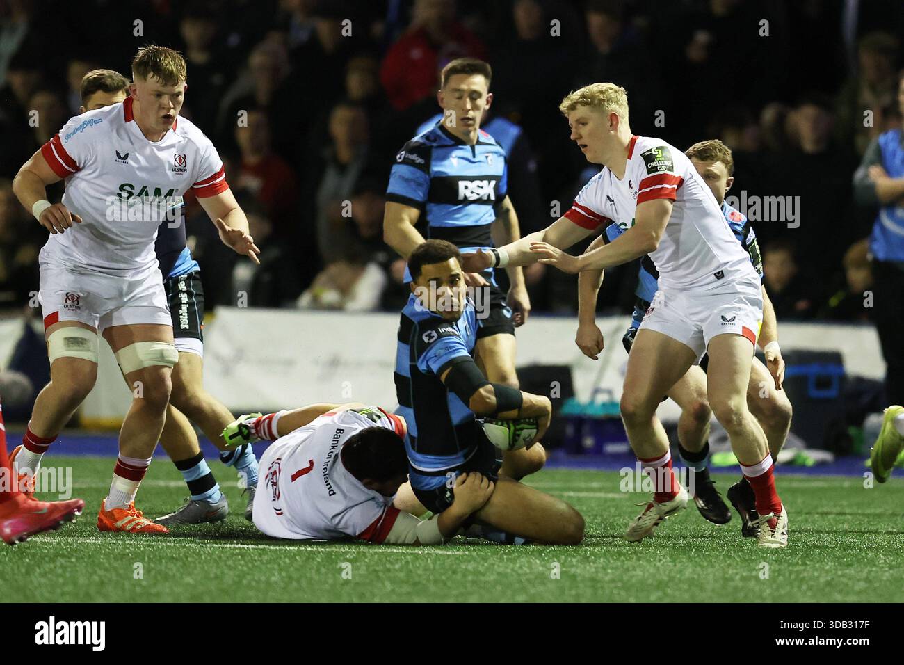 Ben Thomas of Cardiff rugby is tackled by Sam Crean of Ulster (1). EPCR ...
