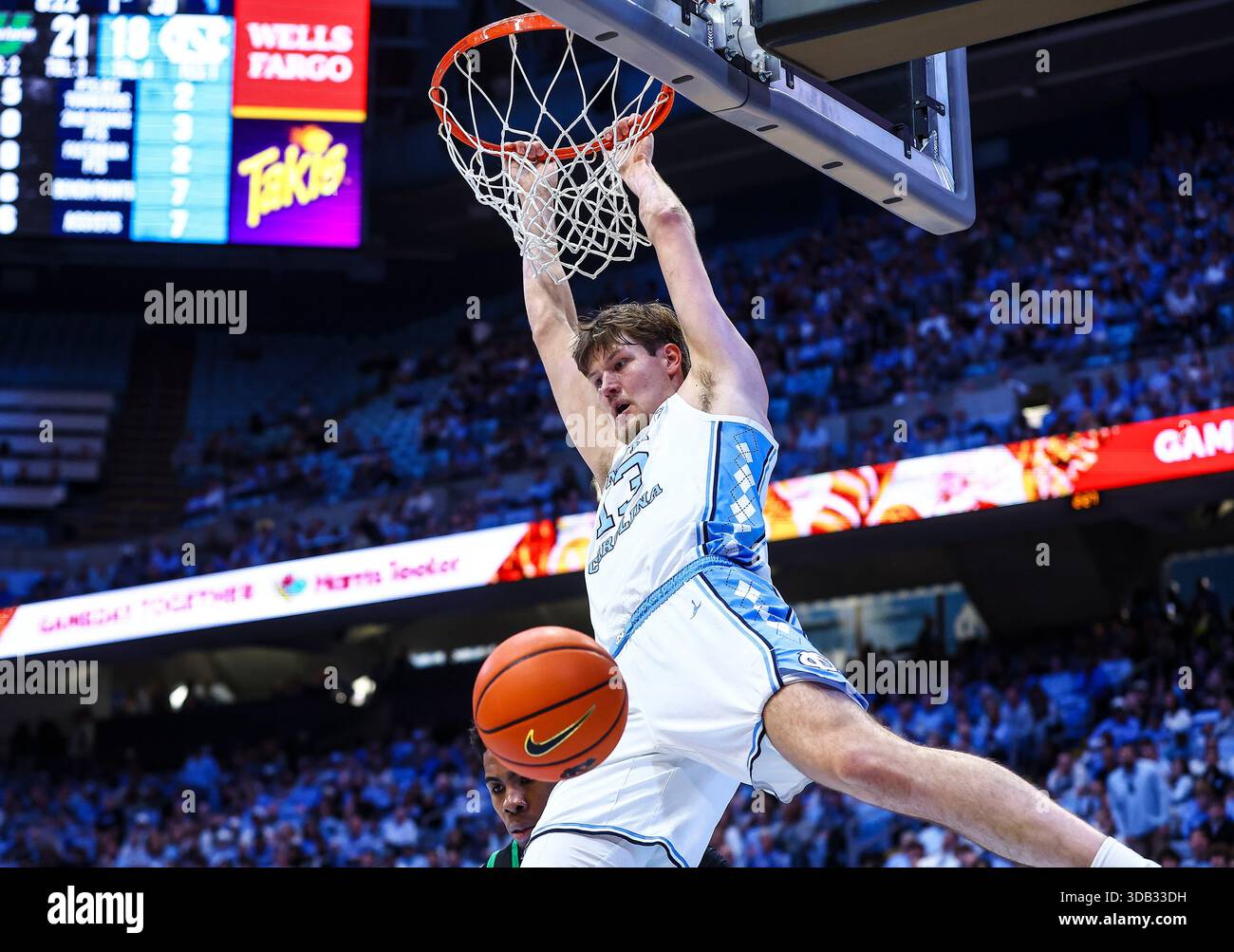 December 13, 2025: North Carolina center Henri Veesaar (13) dunks ball ...