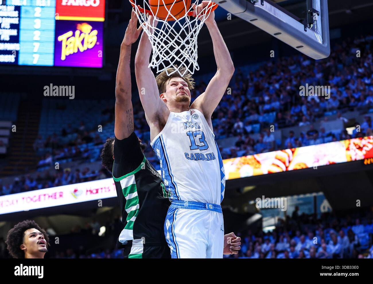 December 13, 2025: North Carolina center Henri Veesaar (13) dunks ball ...