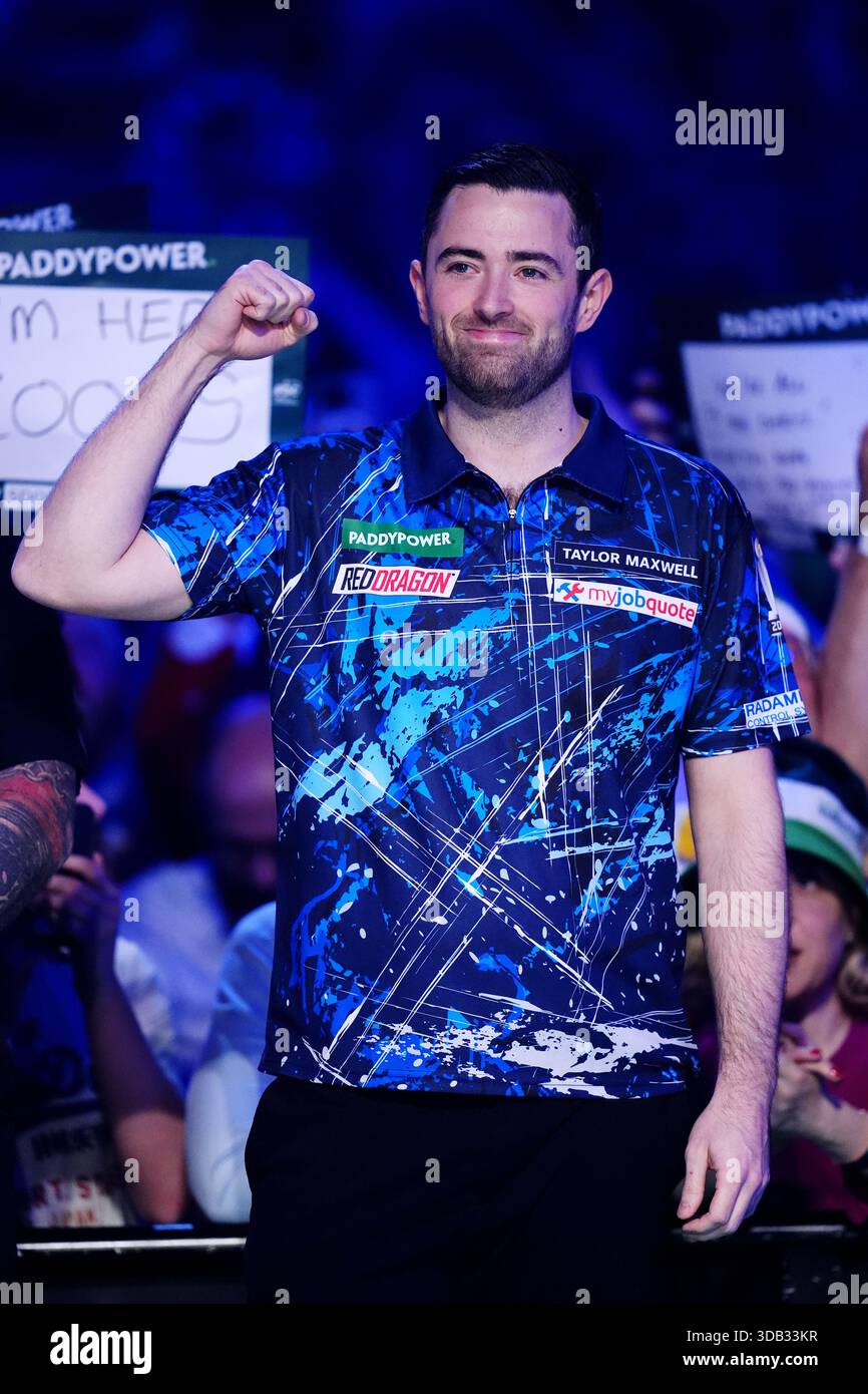 Luke Humphries walks out to play their match against Ted Evetts on day ...