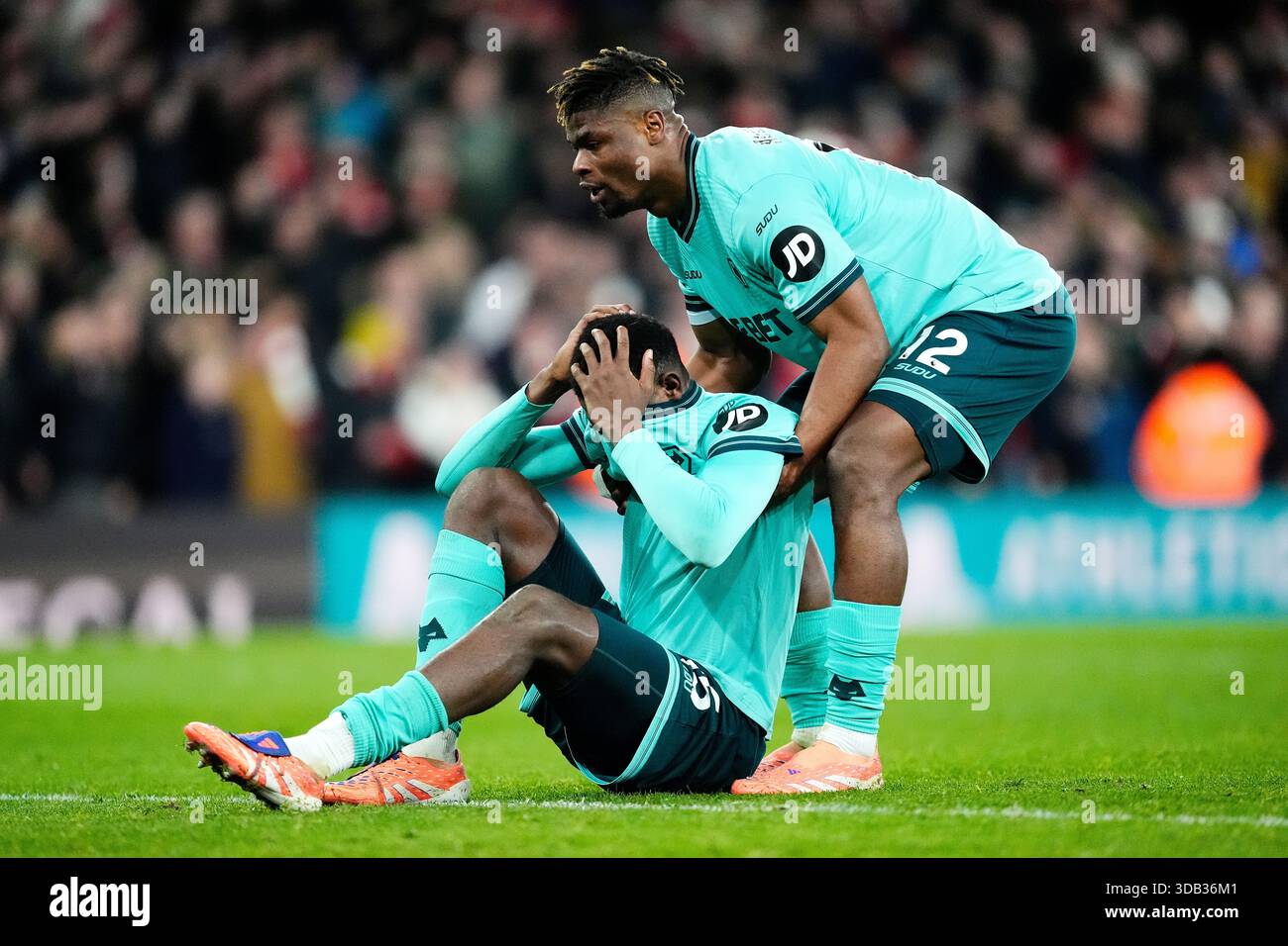 Wolverhampton Wanderers' Yerson Mosquera (left) reacts after scoring an own goal with Emmanuel ...