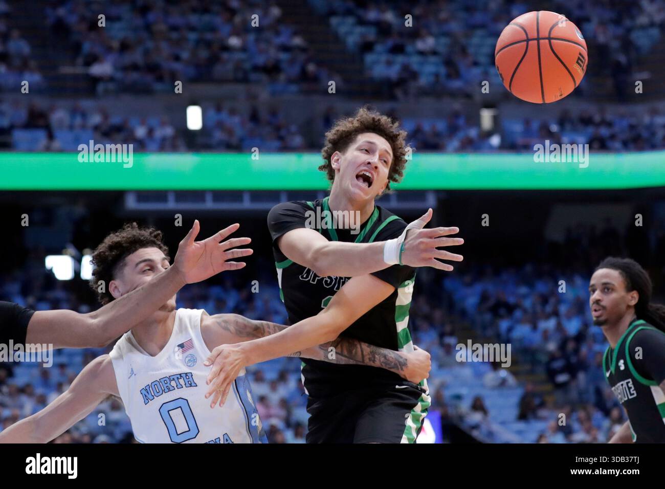 North Carolina guard Kyan Evans (0) and USC Upstate forward Jafeth ...