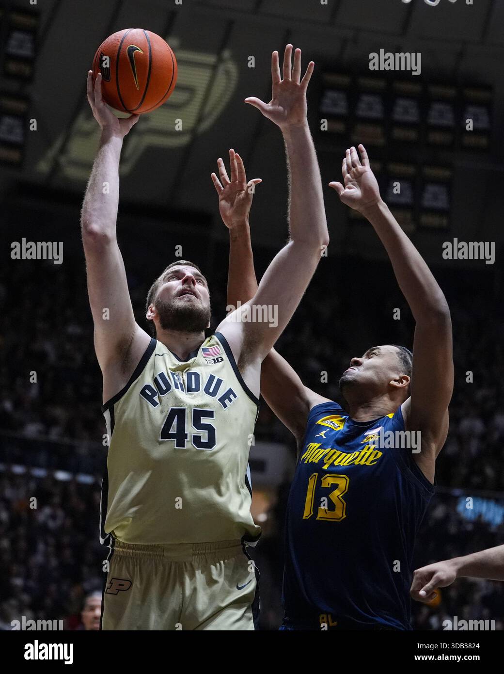 Purdue center Oscar Cluff (45) shoots over Marquette forward Royce ...