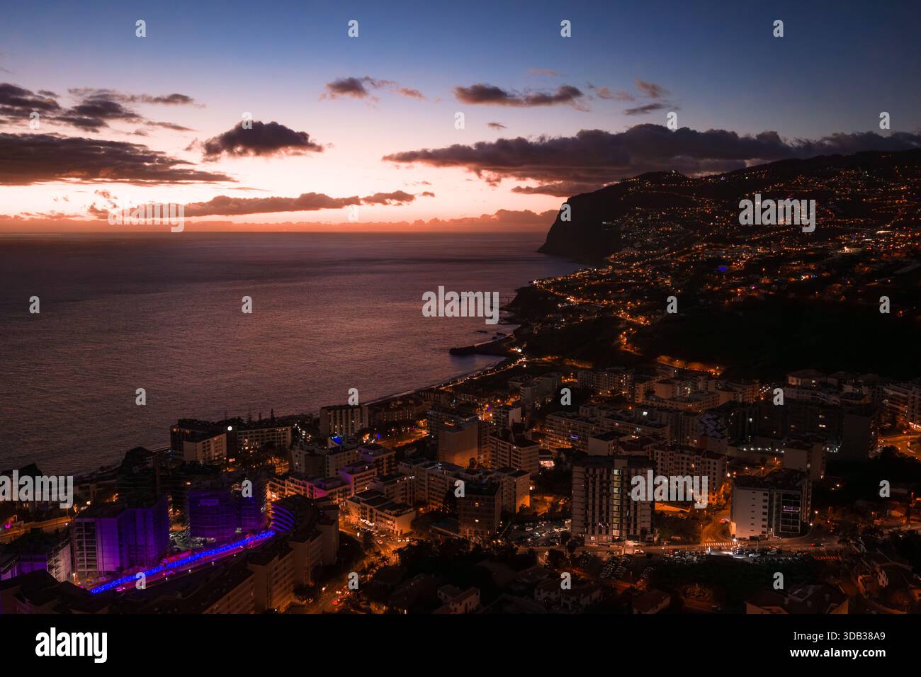 Aerial twilight view of Funchal curving around the Atlantic bay Stock ...