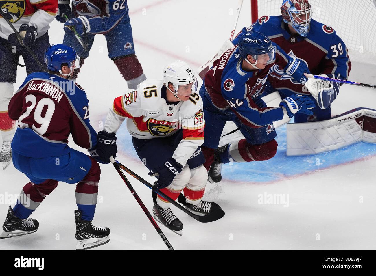 Florida Panthers center Anton Lundell (15) drives between Colorado ...