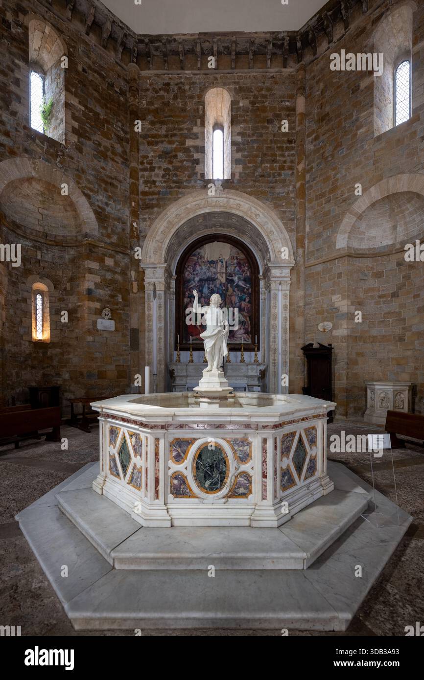 Volterra, Italy - Jul 21, 2025: Marble baptismal font and statue inside ...