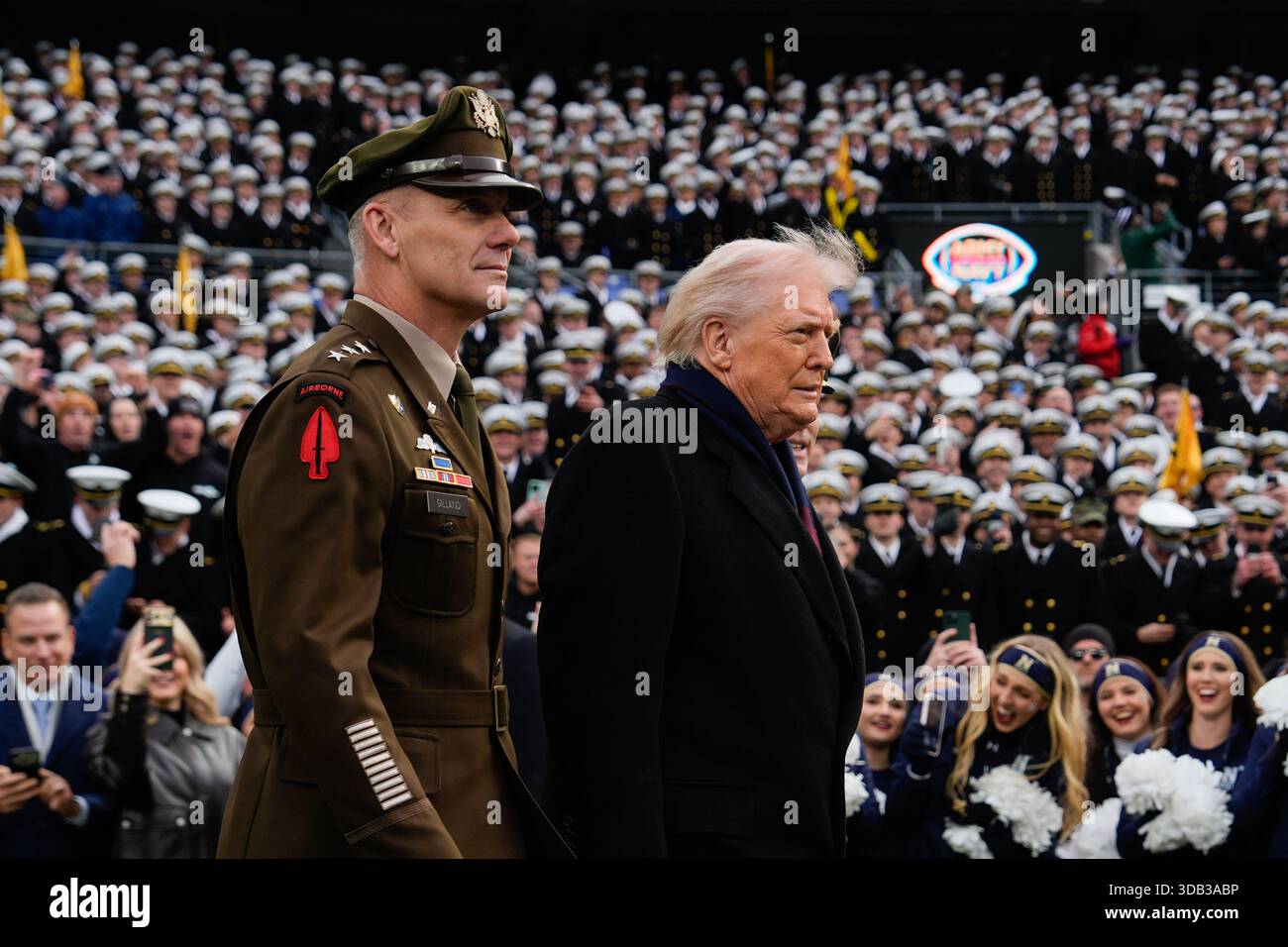 President Donald Trump walks onto the field with Lt. Gen. Steven ...