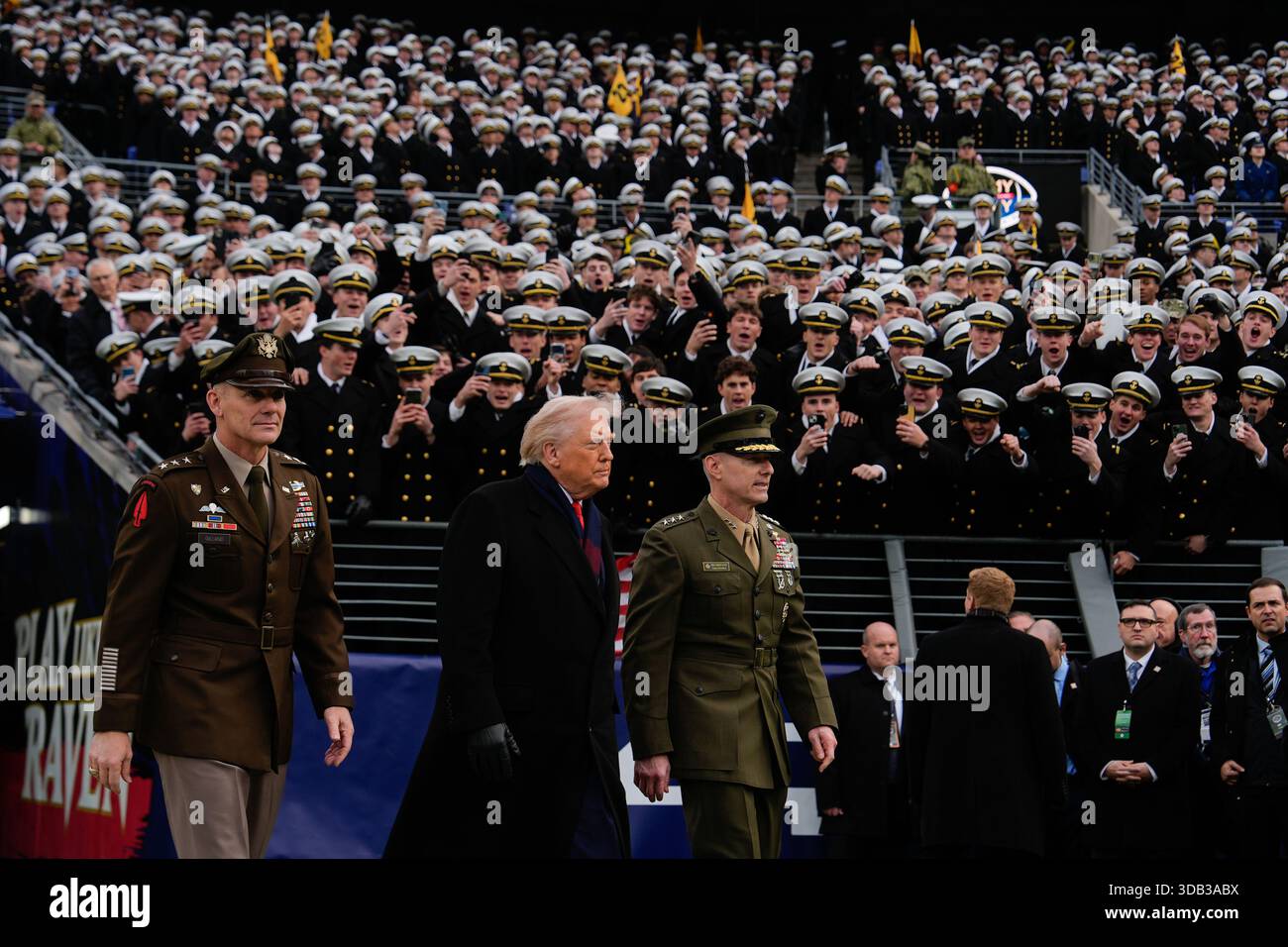President Donald Trump walks onto the field with Lt. Gen. Steven ...