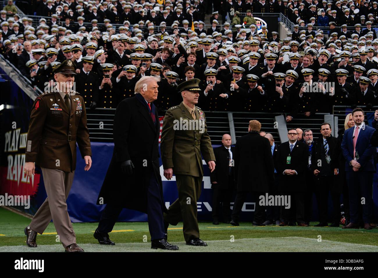 President Donald Trump walks onto the field with Lt. Gen. Steven ...