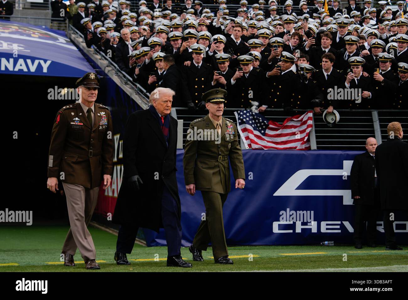 President Donald Trump walks onto the field with Lt. Gen. Steven ...