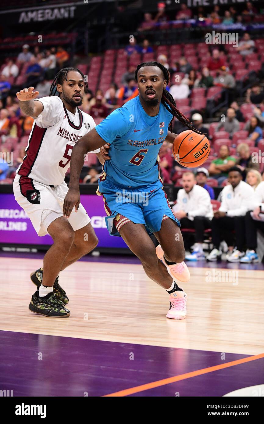 Florida State Guard Robert McCray V (6) drives towards the basket ...
