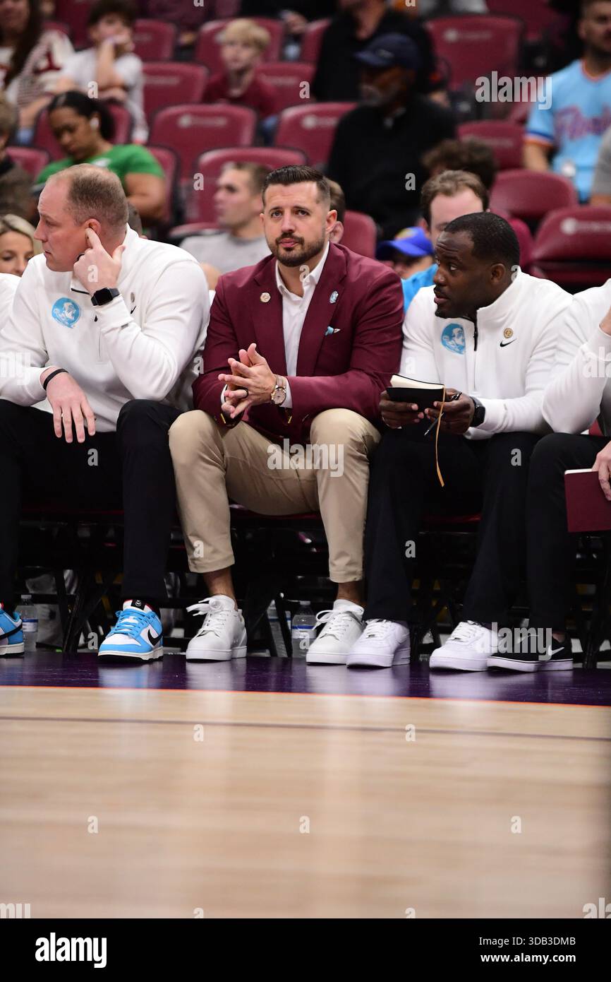 Florida State Head Coach Luke Loucks watches the action from the bench ...