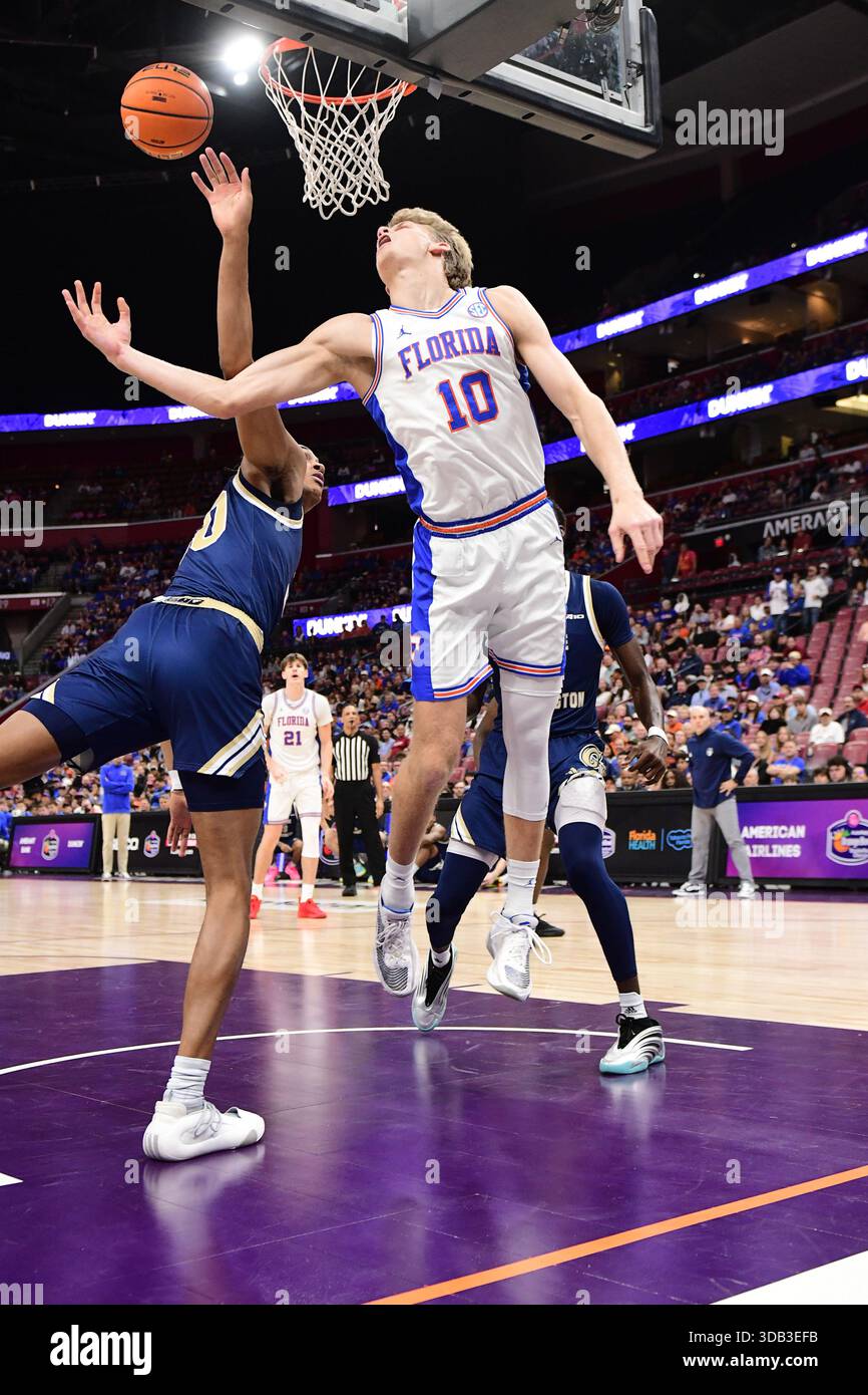 Florida Forward Thomas Haugh (10) is fouled during a shot attempt ...