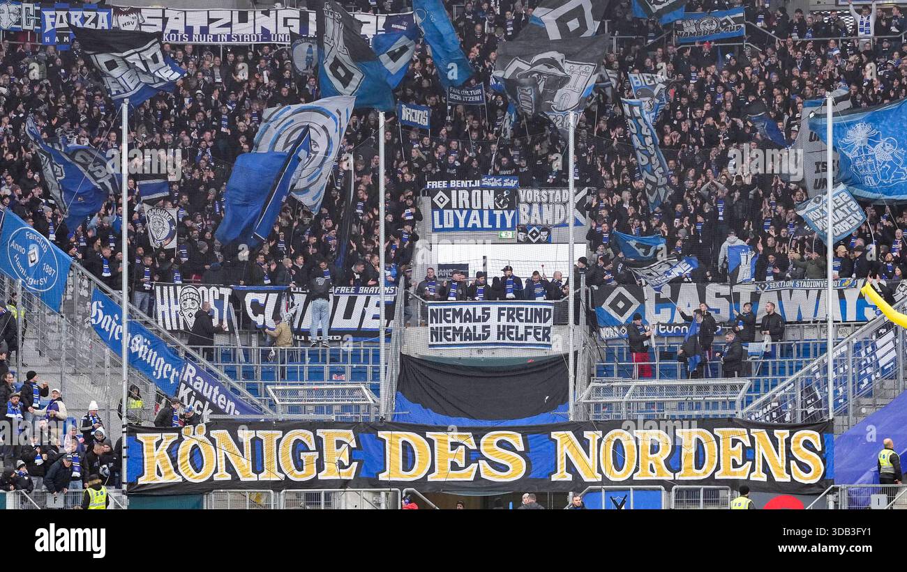 The traveling ultras of HSV Hamburg (HSV Hamburg) wave their flags in ...