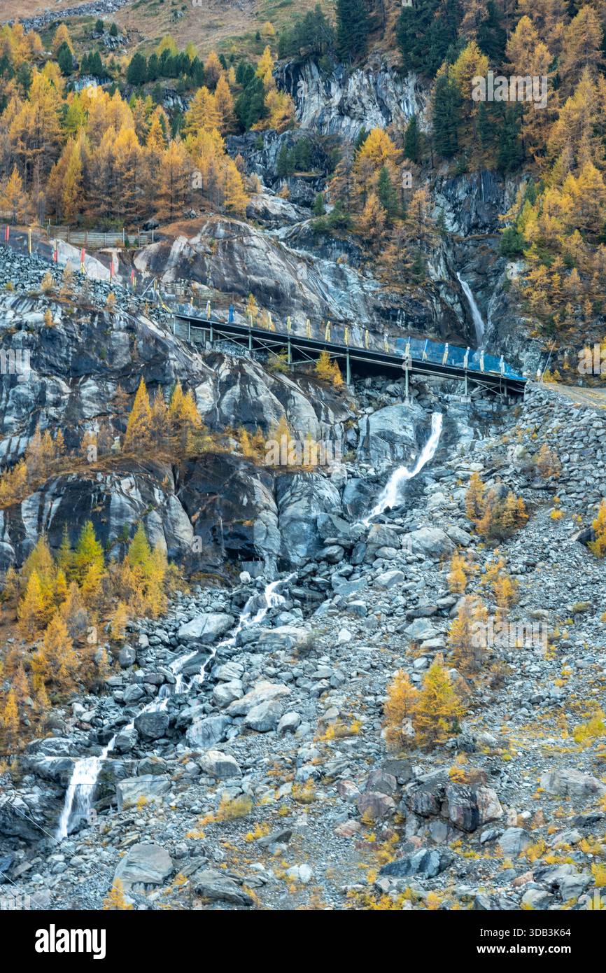 Steep Bridge Spans Waterfall Above Gorner Gorge in the Swiss alps Stock ...
