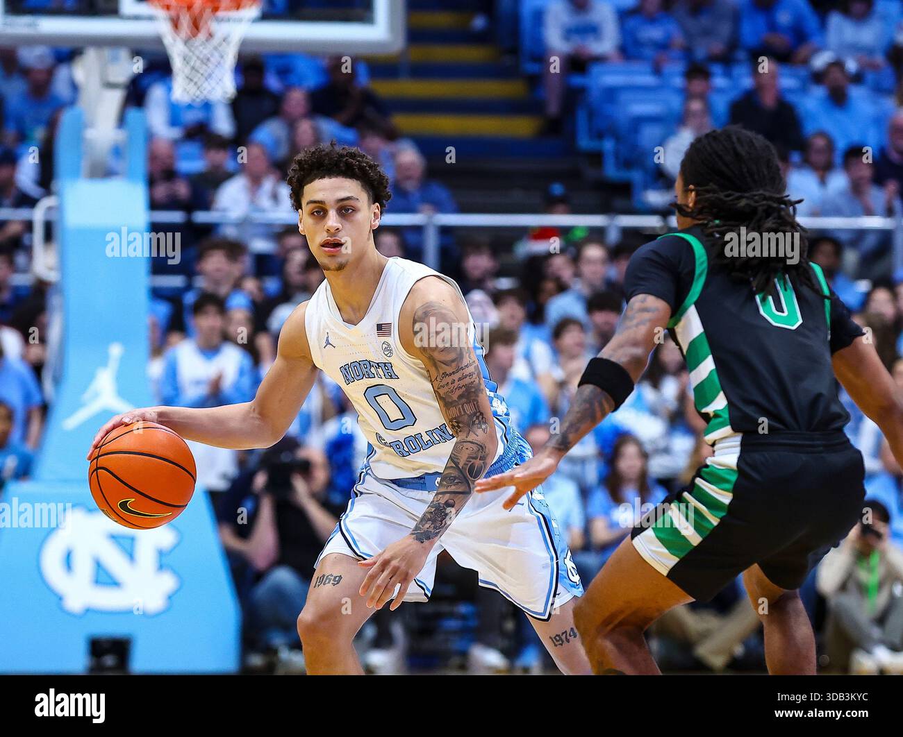 December 13, 2025: North Carolina guard Kyan Evans (0) brings ball up ...