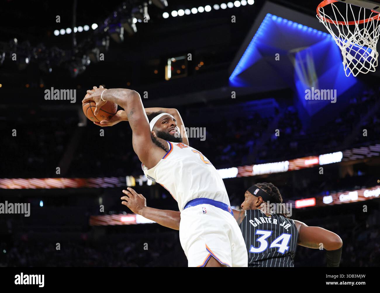 New York Knicks center Mitchell Robinson (23) grabs a rebound near ...