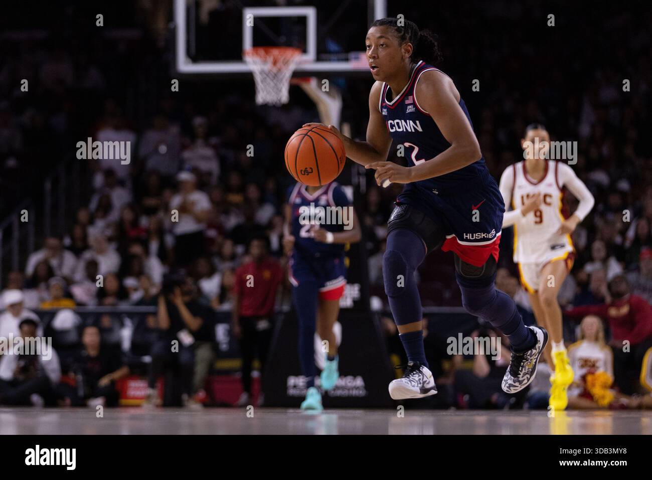 UConn guard Kk Arnold (2) dribbles the ball during the second half of ...