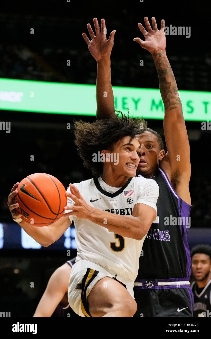 Vanderbilt guard Tyler Tanner (3) passes the ball around Central ...