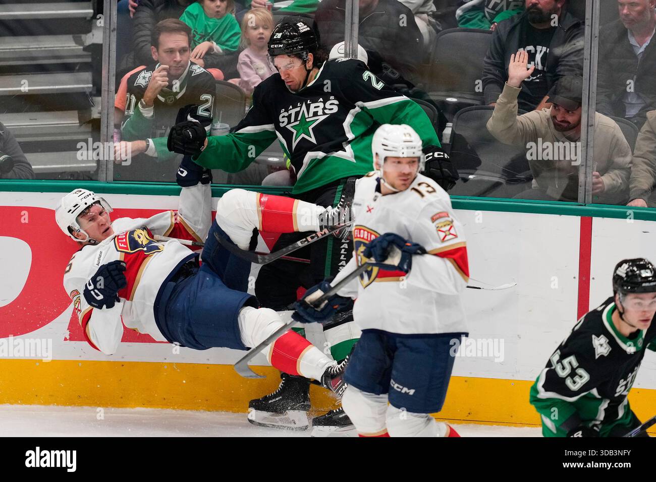 Florida Panthers center Anton Lundell, left, is knocked down by Dallas ...