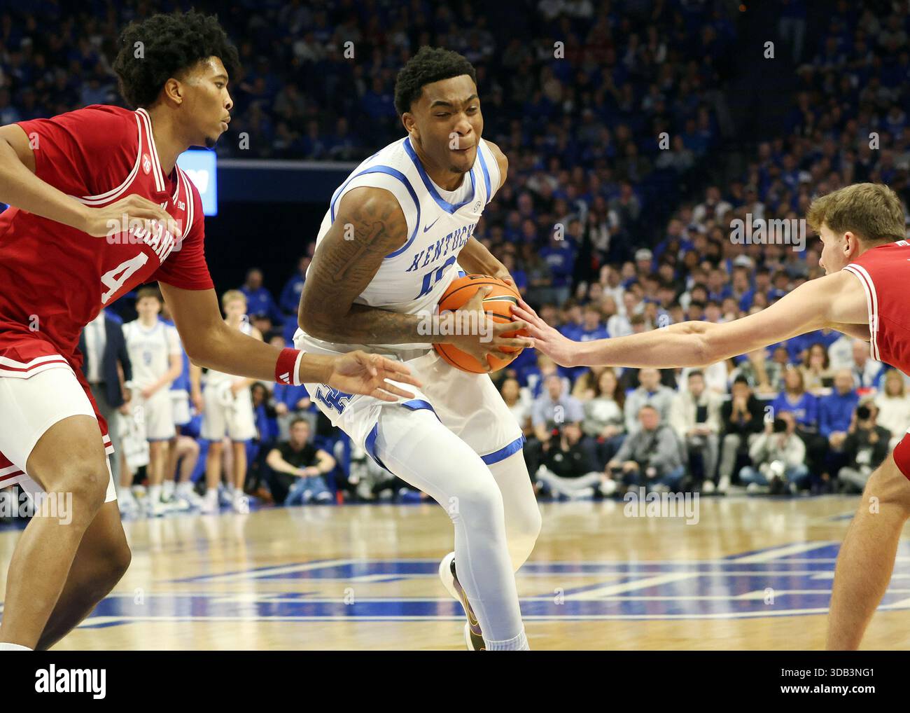 Kentucky's Brandon Garrison, center, drives between Indiana's Sam ...