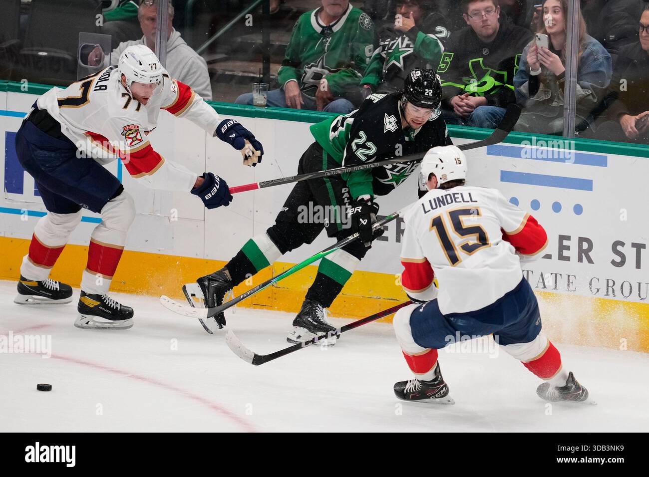 Dallas Stars center Mavrik Bourque (22) makes a pass between Florida ...