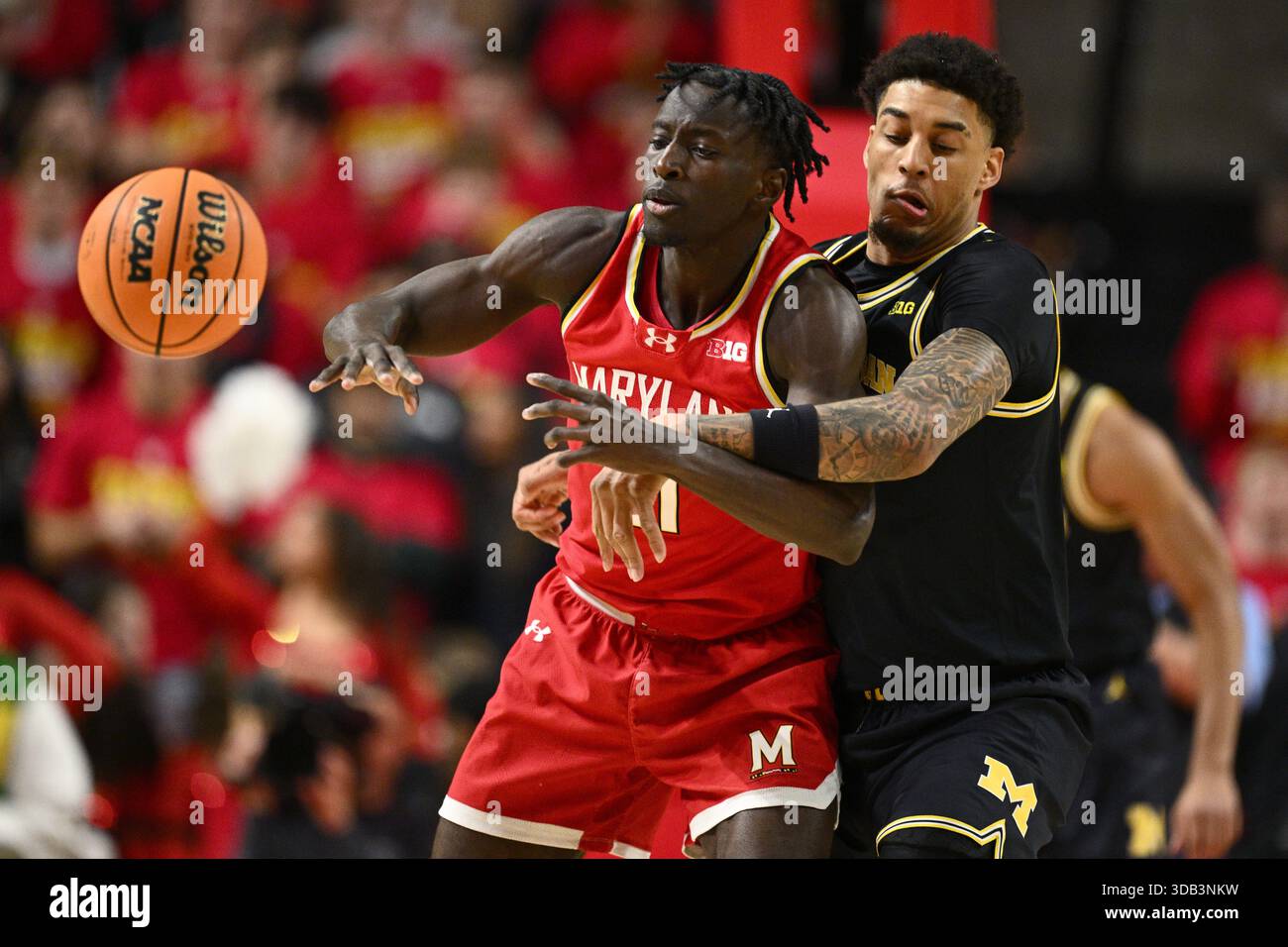 Michigan forward Yaxel Lendeborg, right, and Maryland guard George ...