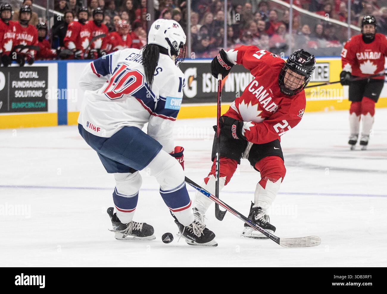 United States' Laila Edwards (10) and Canada's Emma Maltais (27) battle ...