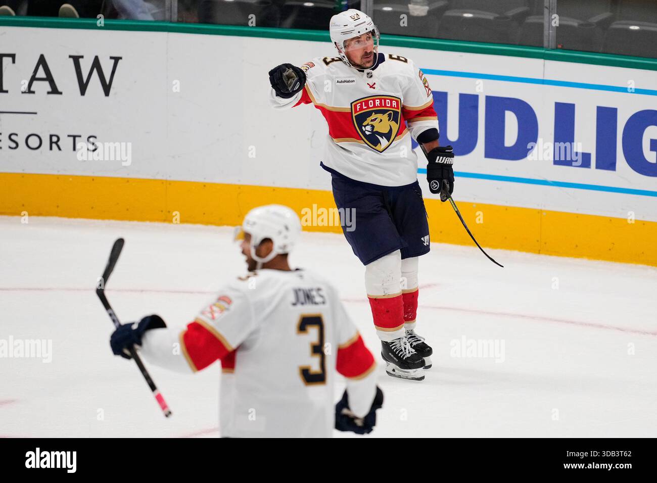 Florida Panthers' Seth Jones (3) and Brad Marchand, right, celebrate ...