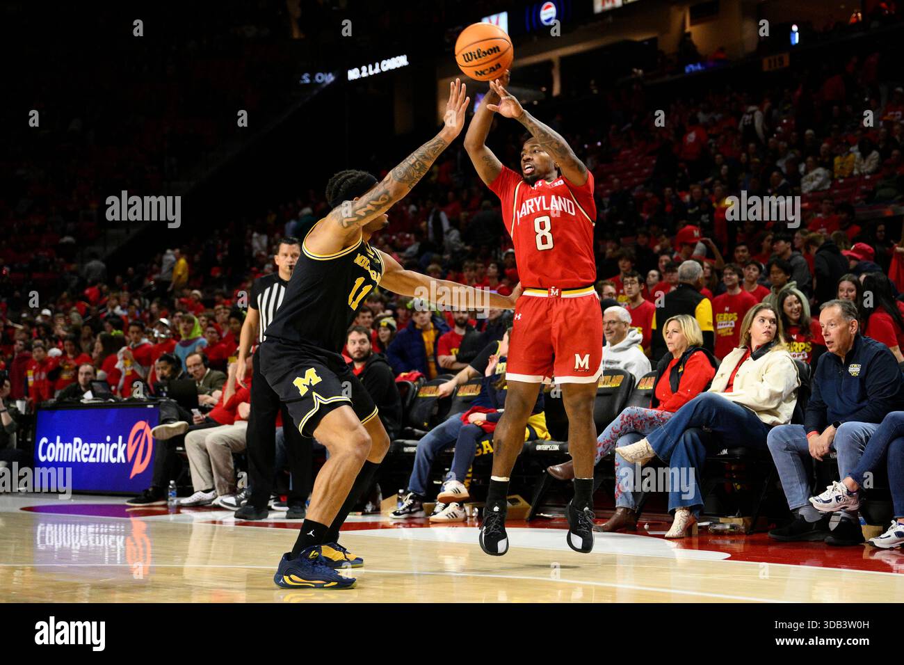Maryland guard David Coit (8) passes the ball against Michigan guard ...