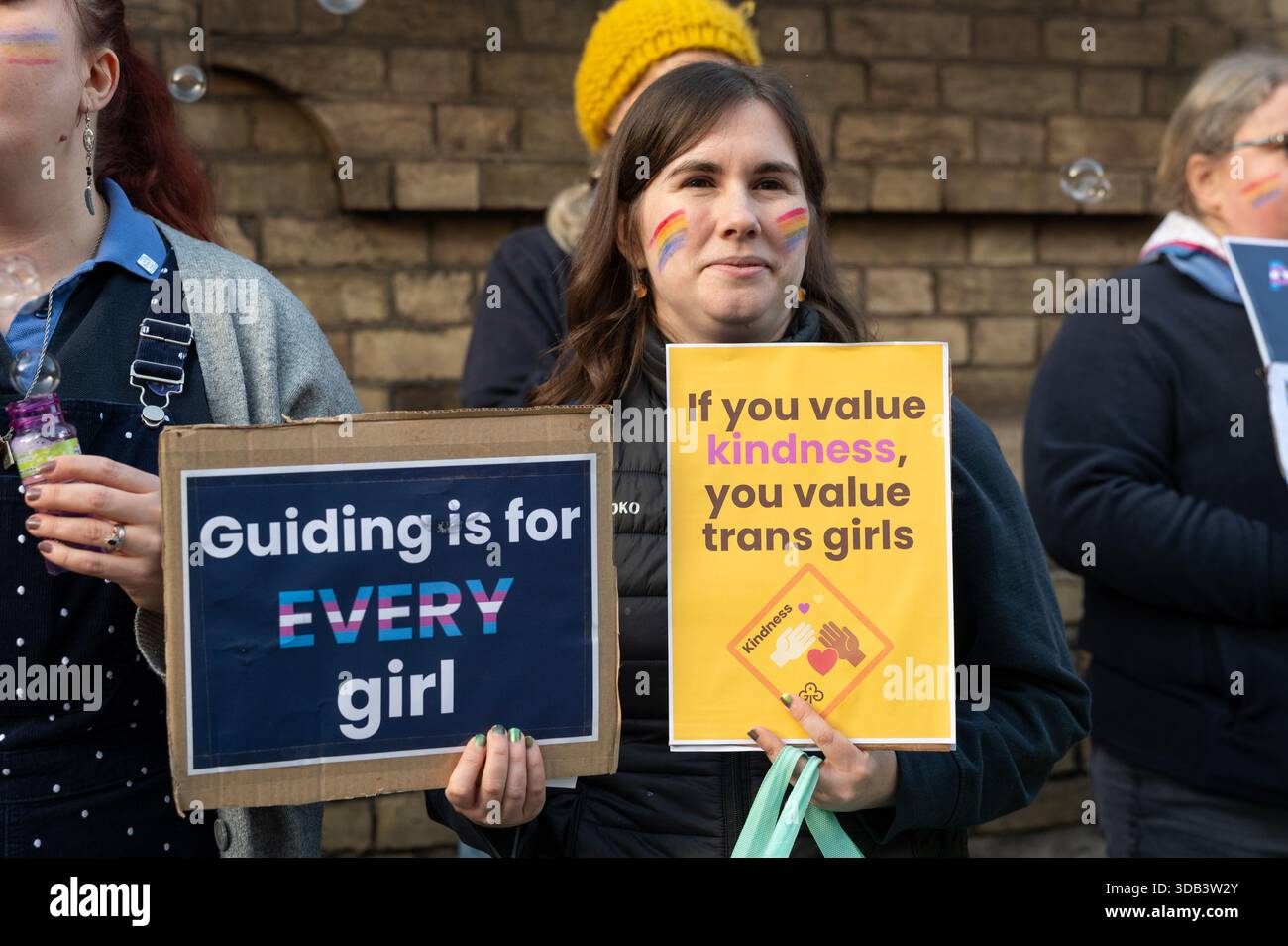 A protester holds placards expressing her opinion during the ...