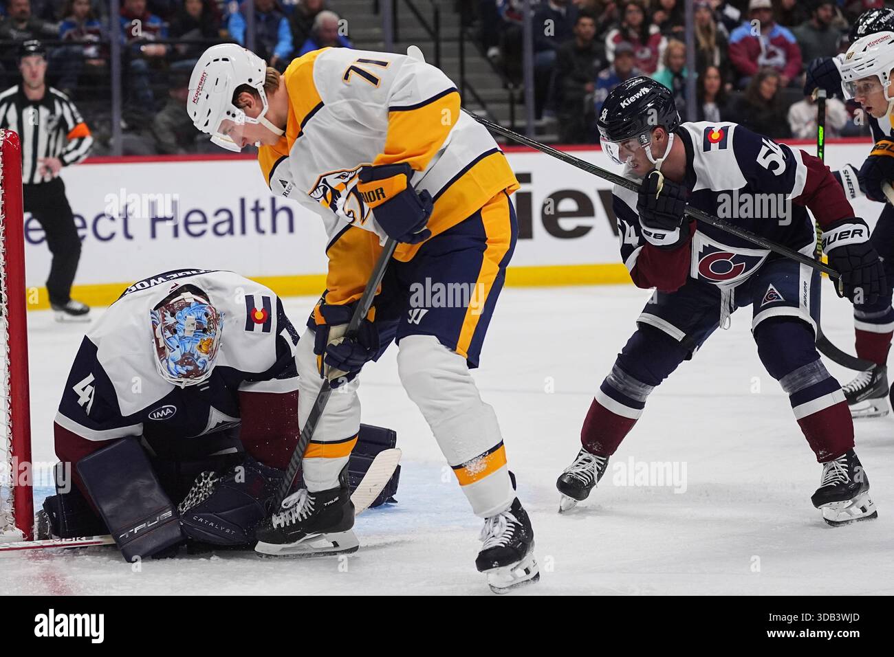 Nashville Predators right wing Matthew Wood, center, has his shot ...