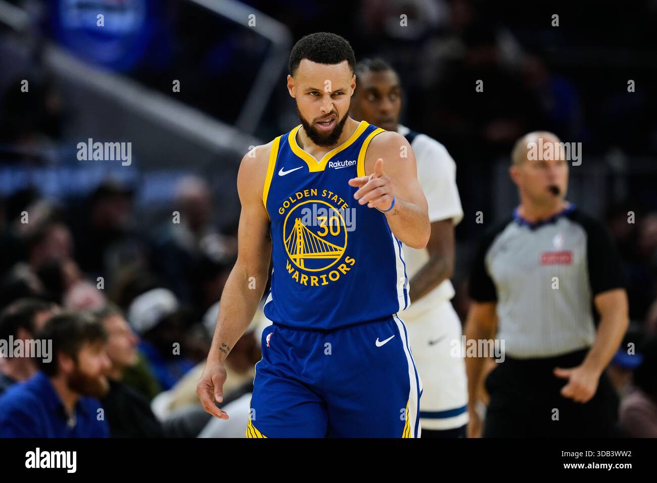 Golden State Warriors guard Stephen Curry (30) gestures toward the ...