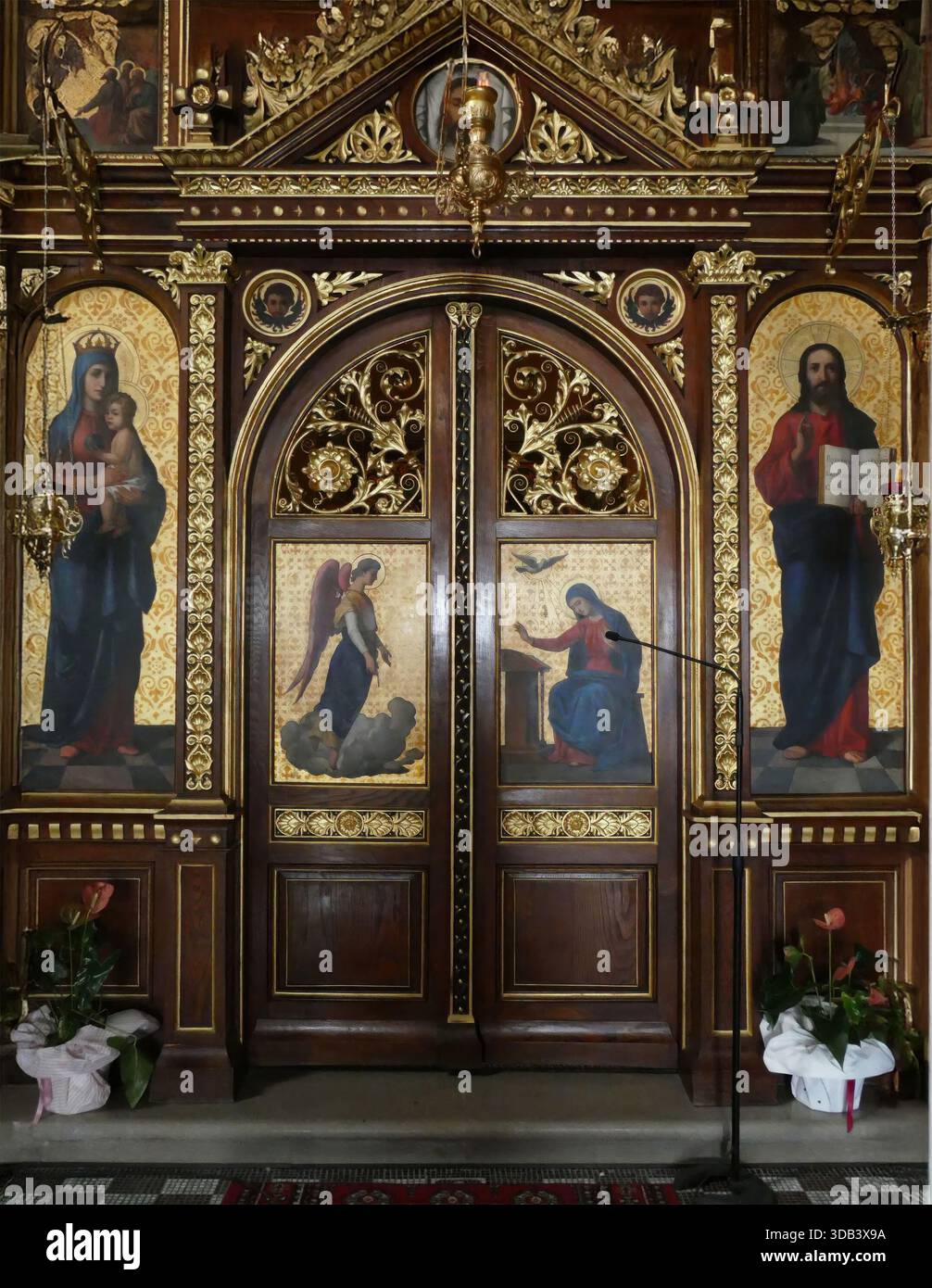 Religious wooden altar doors with gilded panels, featuring Annunciation ...
